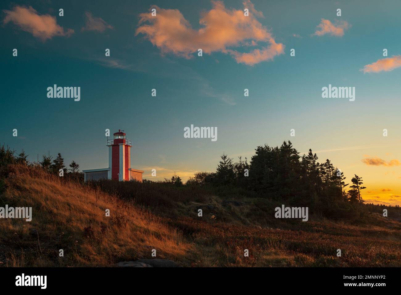 The Point Prim Lighthouse at sunset near Digby, Nova Scotia, Canada ...