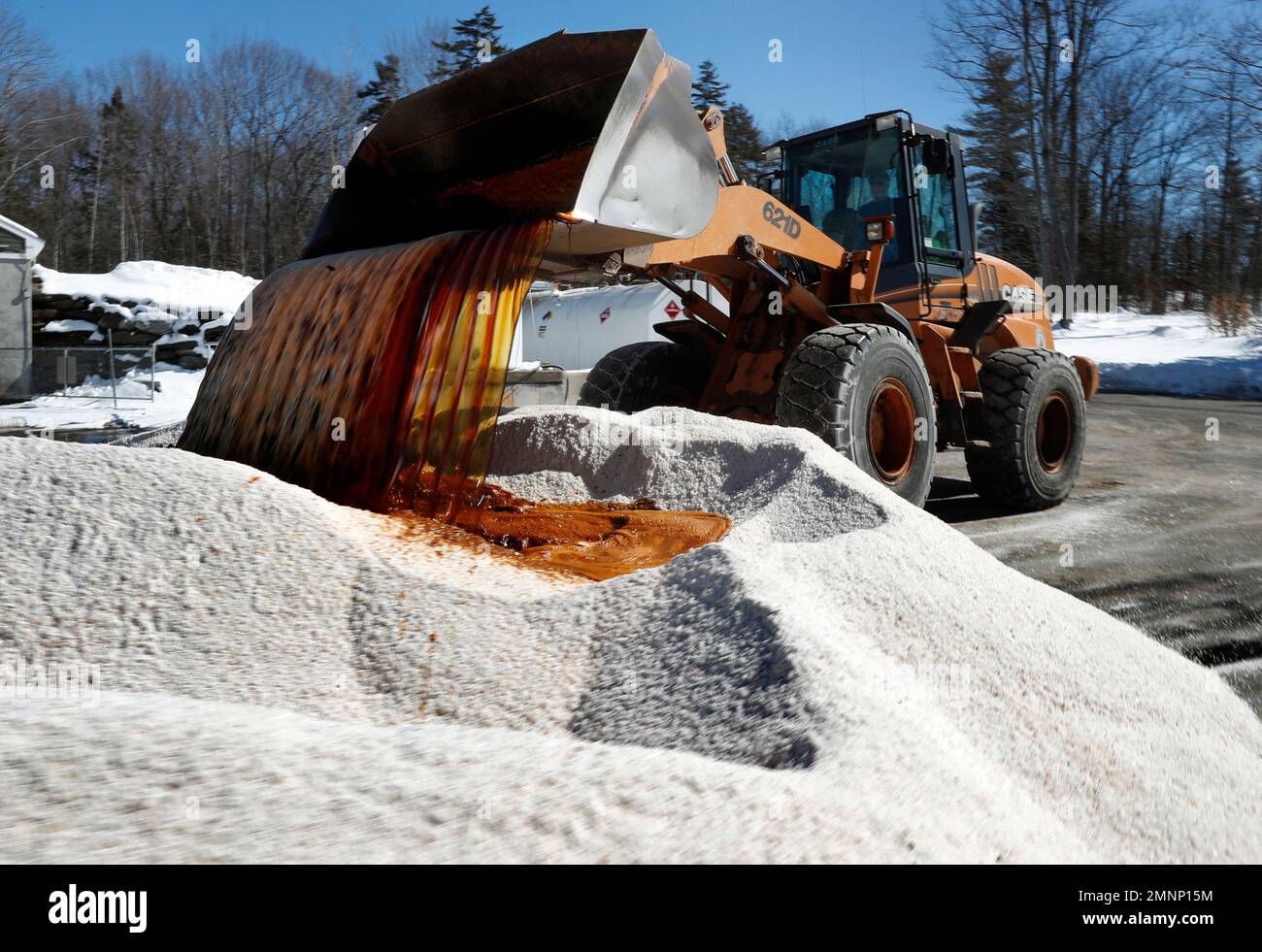 David Osgood, crew leader of the public works deptartment, mixes "Ice-B ...