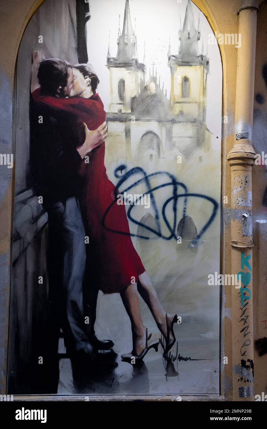Street art of lovers kissing with graffiti, under Charles Bridge ...