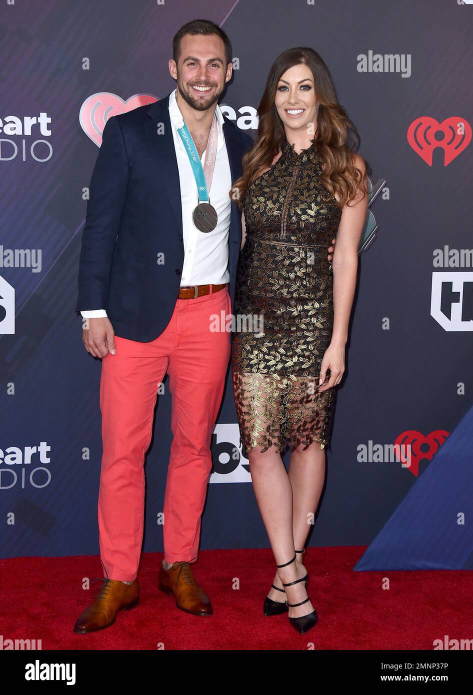 Chris Mazdzer, left, and Mara Marian arrive at the iHeartRadio Music ...