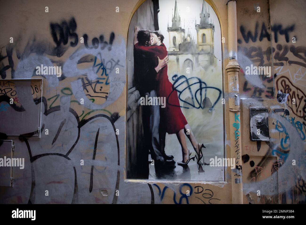 Street art of lovers kissing with graffiti, under Charles Bridge ...