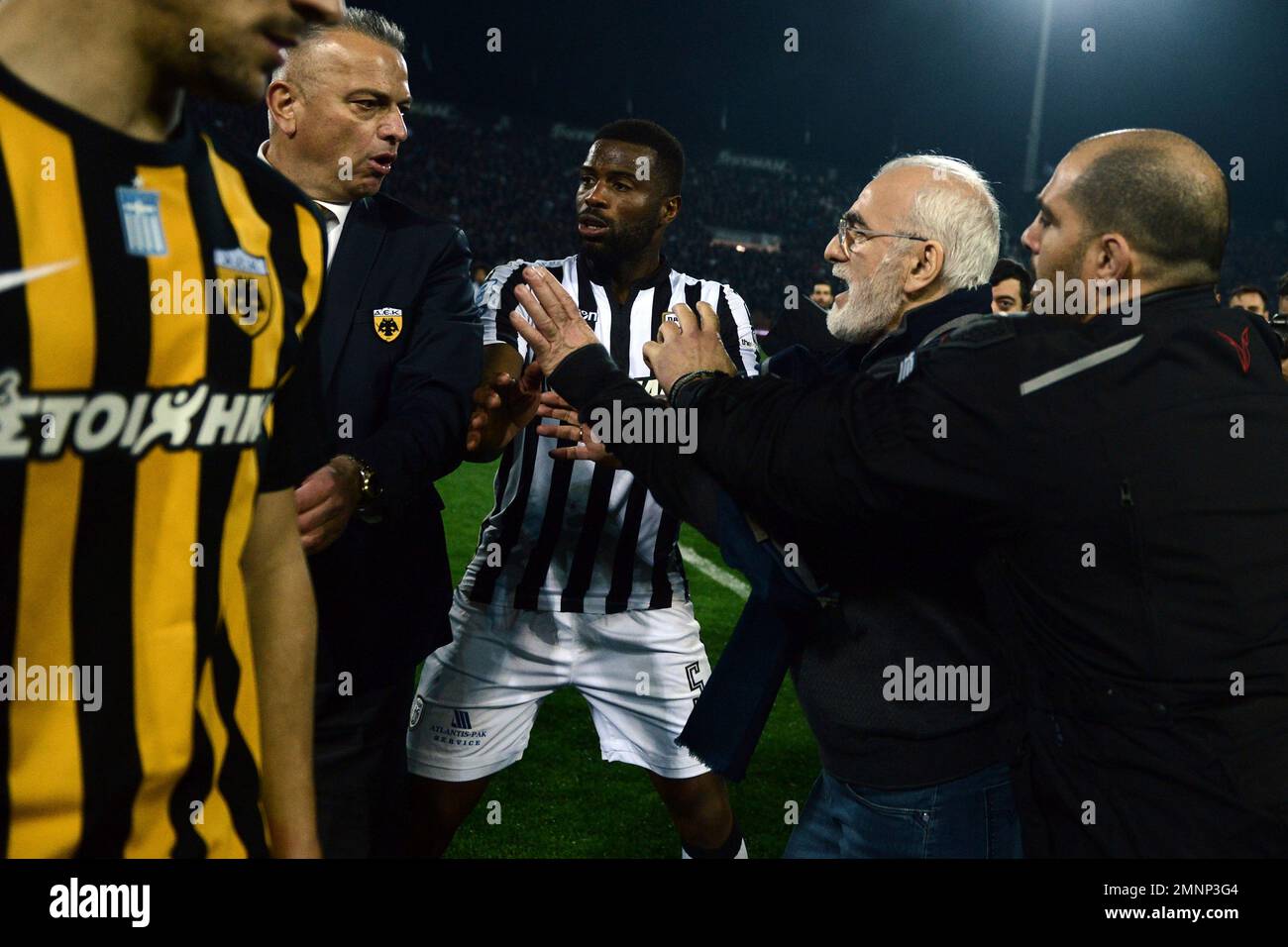 PAOK owner, businessman Ivan Savvidis, second right, approaches AEK ...