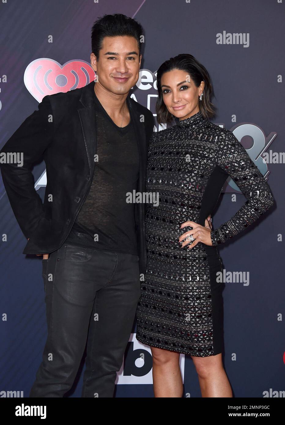 Mario Lopez, left, and Courtney Mazza arrive at the iHeartRadio Music ...
