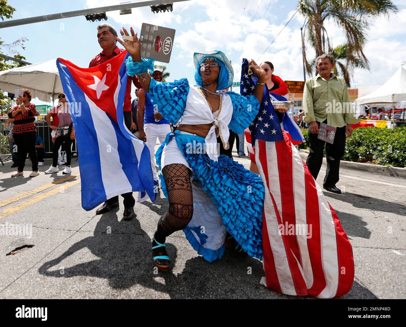 Lucina Michel, right, and her husband Caridad Osorio wave American and ...