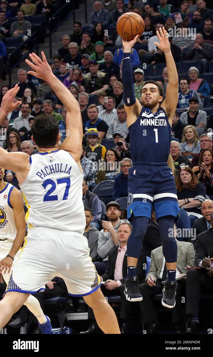 Minnesota Timberwolves' Tyus Jones, right, shoots and scores over ...