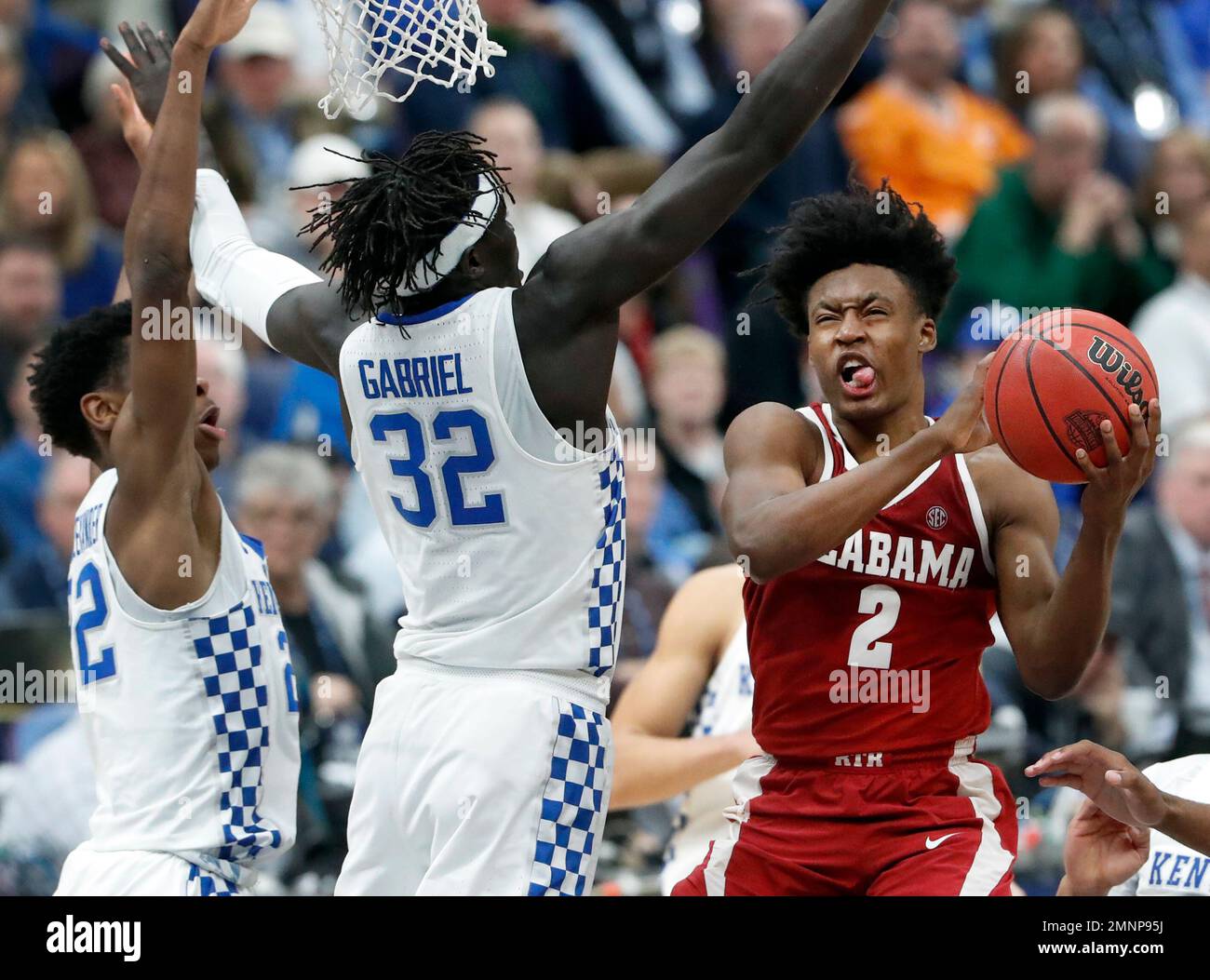 Alabama's Collin Sexton (2) heads to the basket as Kentucky's Wenyen ...