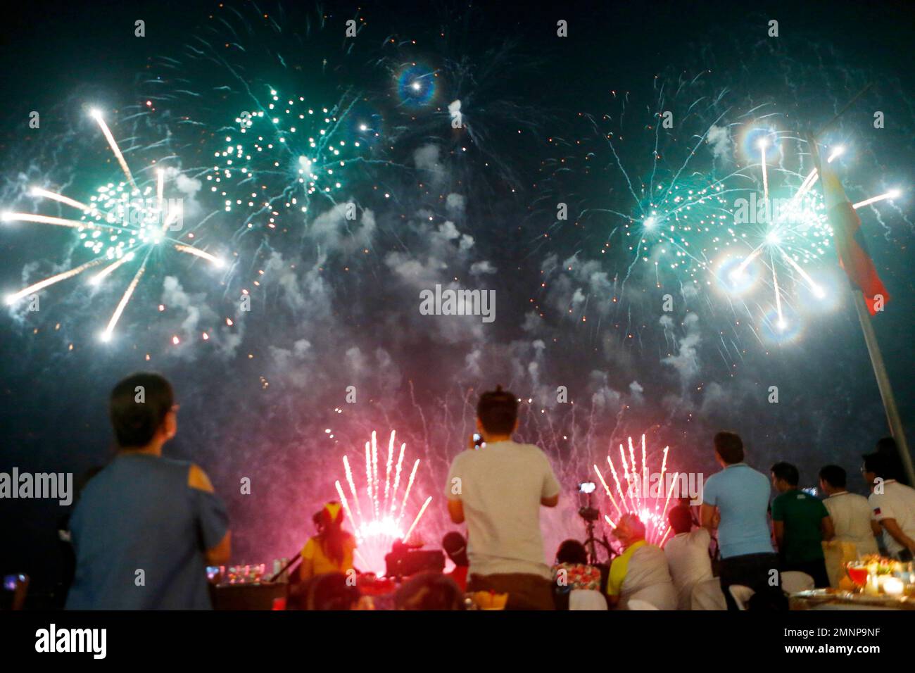 People watch the fireworks display from Italy's Alessi Fuochi ...