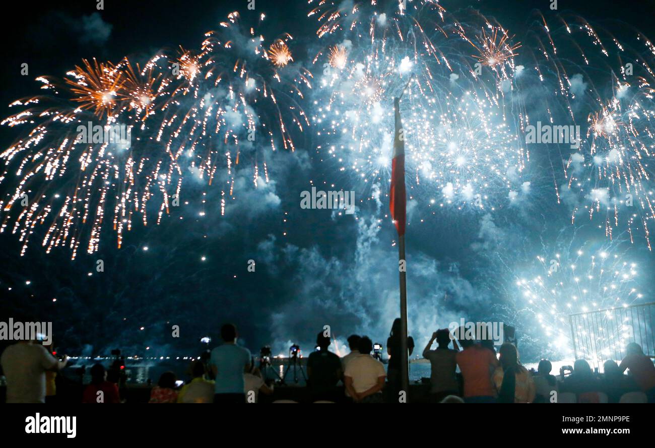 People watch the fireworks display from Italy's Alessi Fuochi ...