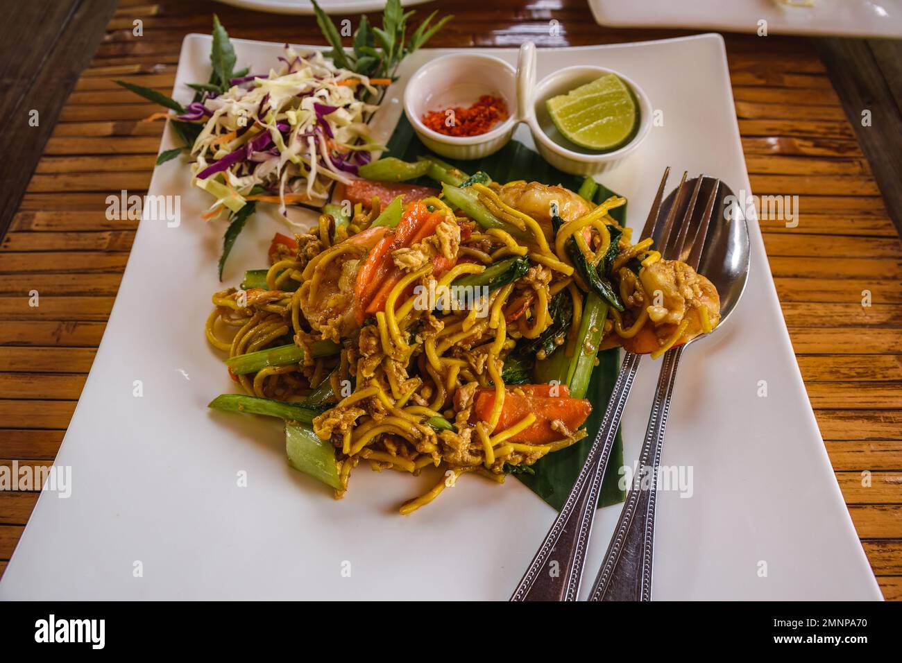 Pad Thai - traditional Thai dish served on a banana leaf in a ...