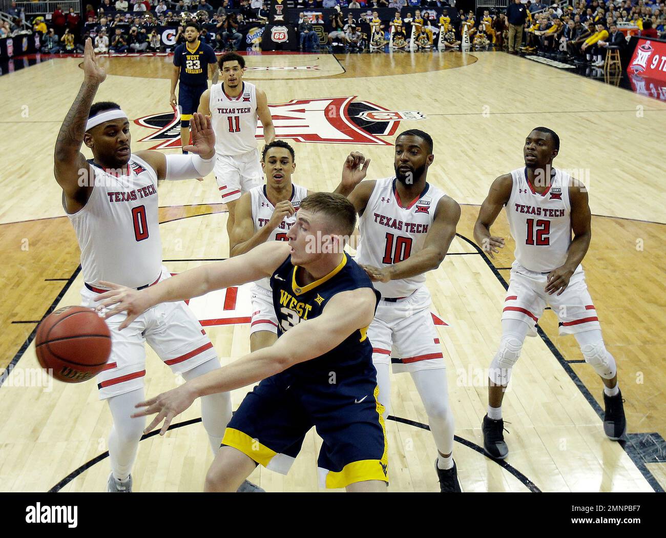 West Virginia's Logan Routt (31) passes the ball past Texas Tech's ...
