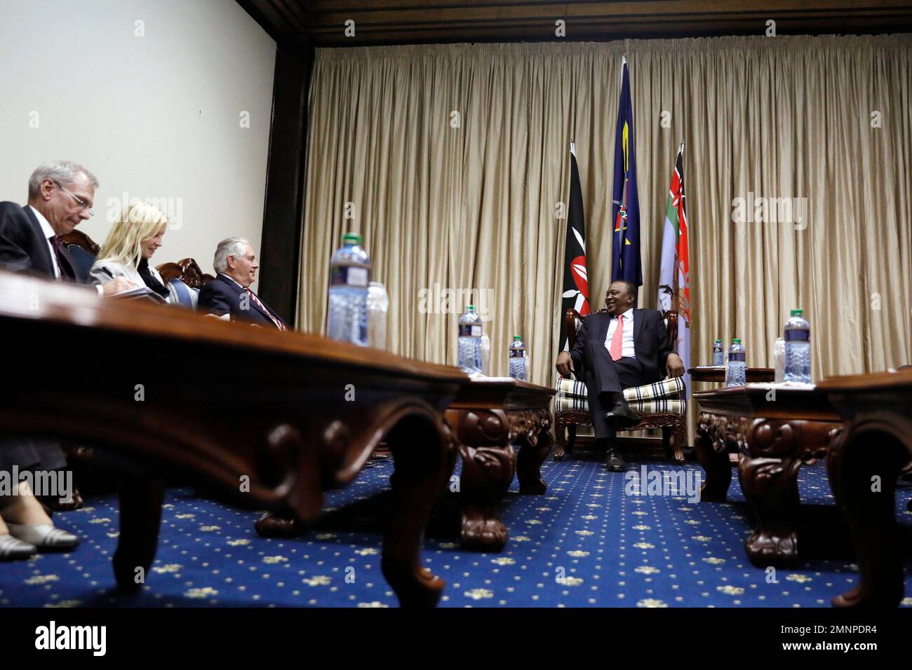 Kenya's President Uhuru Kenyatta, right, greets U.S. Secretary of State ...