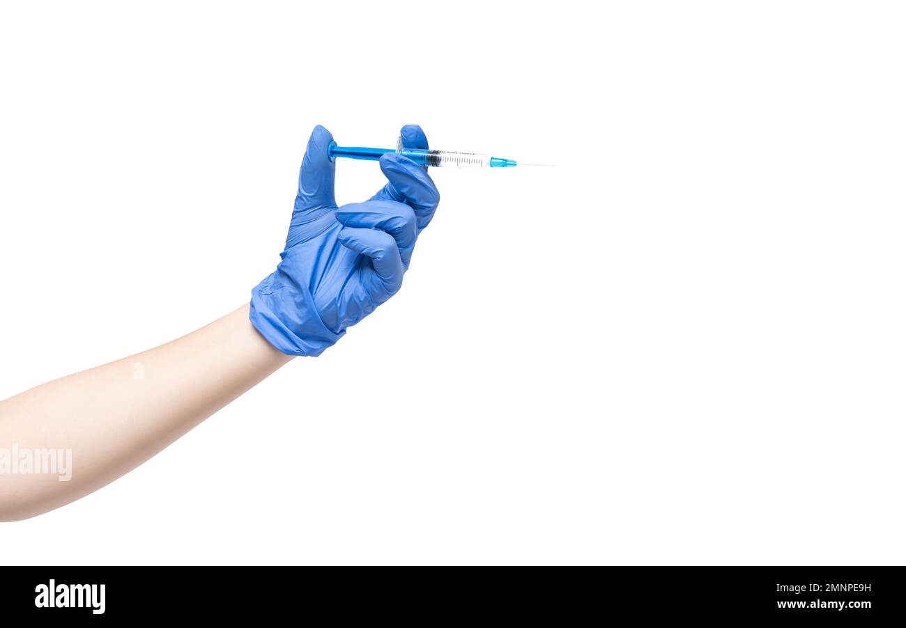 Hand holding a syringe Stock Photo - Alamy
