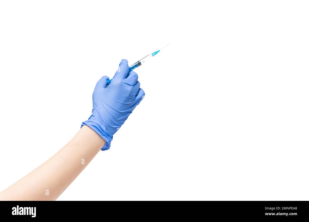 Hand holding a syringe Stock Photo - Alamy