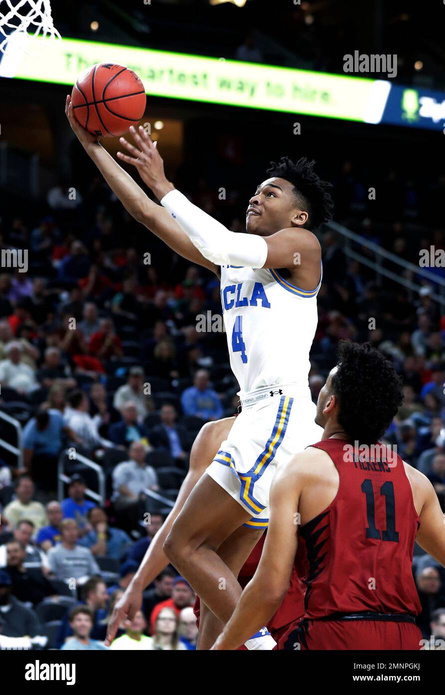 UCLA's Jaylen Hands (4) shoots over Stanford's Dorian Pickens (11 ...