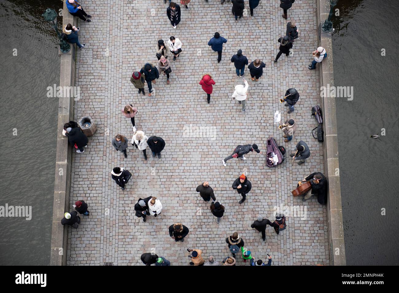 Overhead view of person tipping musicians on bridge from Old Town ...