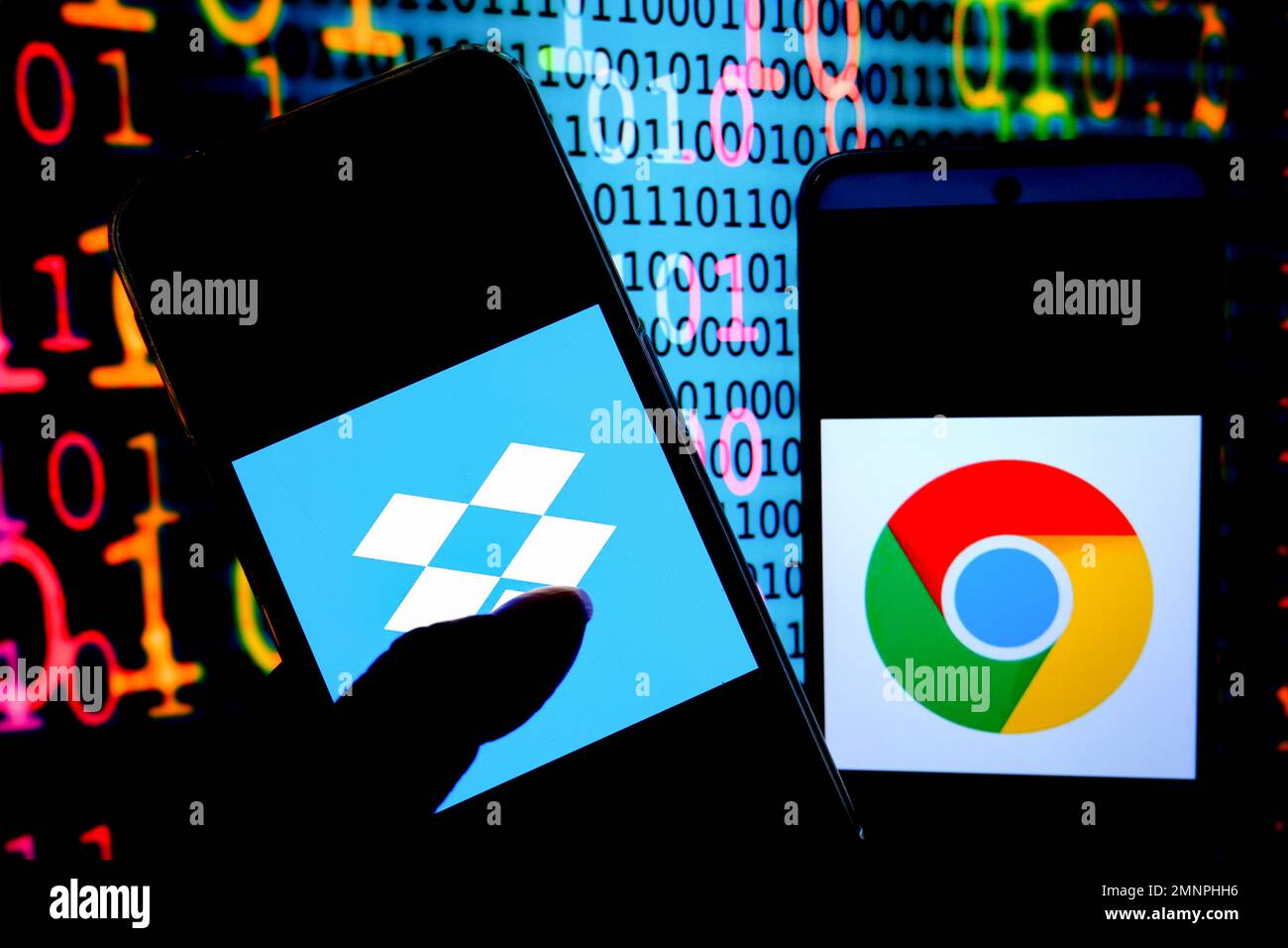 In this photo illustration, a Dropbox logo and Google Chrome Logo seen ...