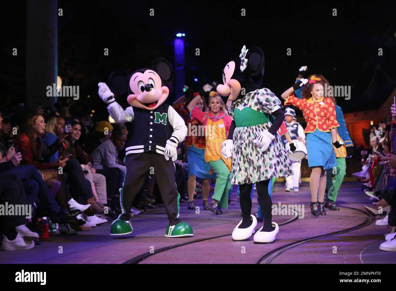 Disney's characters Mickey and Minnie Mouse walk down the runway at the ...