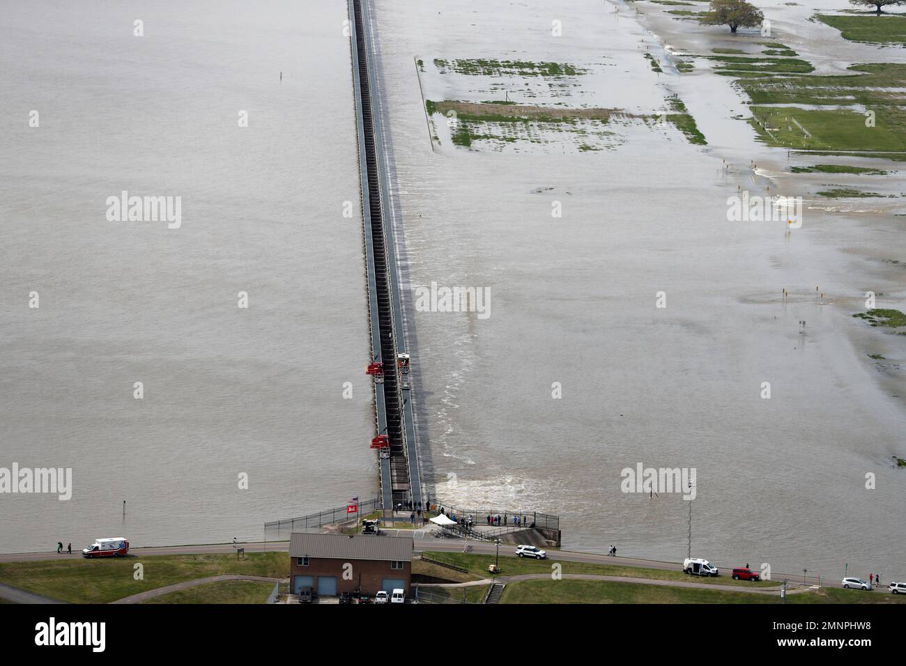 Workers open the gates of the Bonnet Carre spillway, a river diversion ...