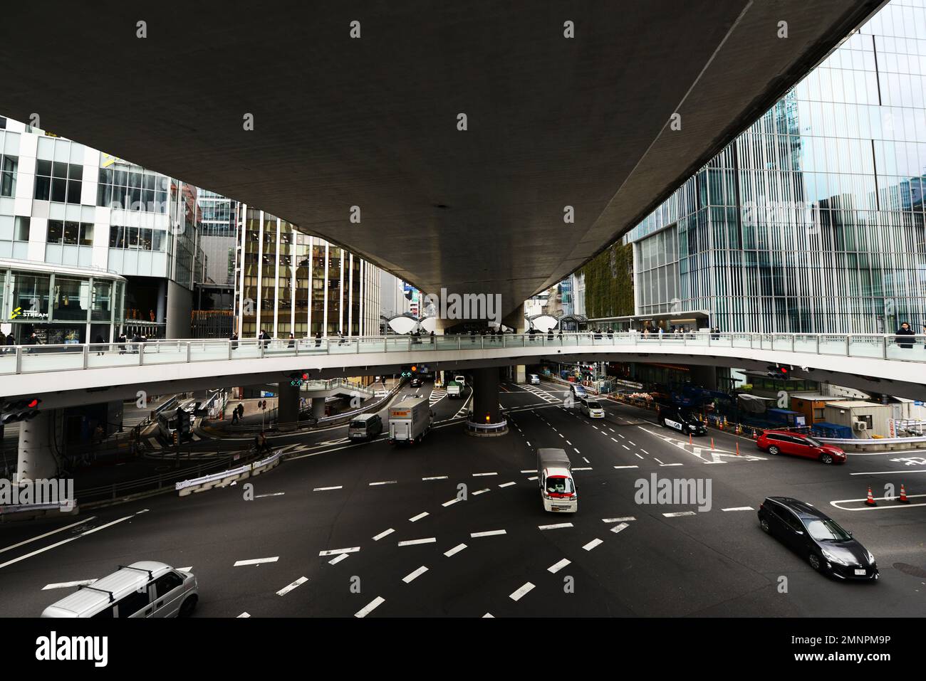 Traffic and a pedestrian bridge under the Metropolitan Expressway Rte ...