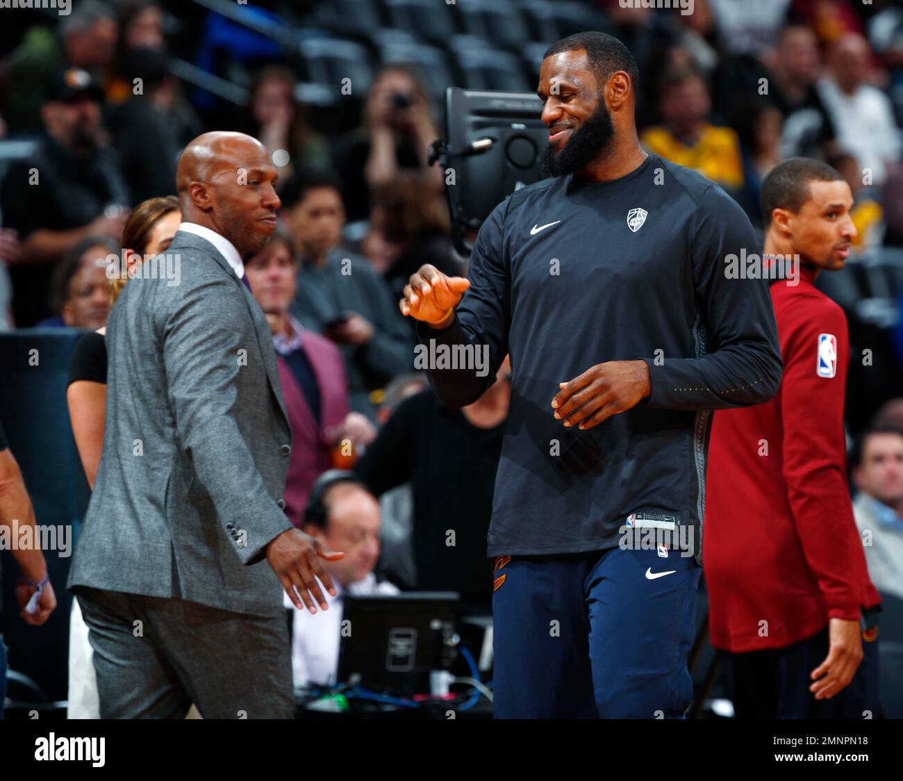 Cleveland Cavaliers forward LeBron James, right, greets television ...
