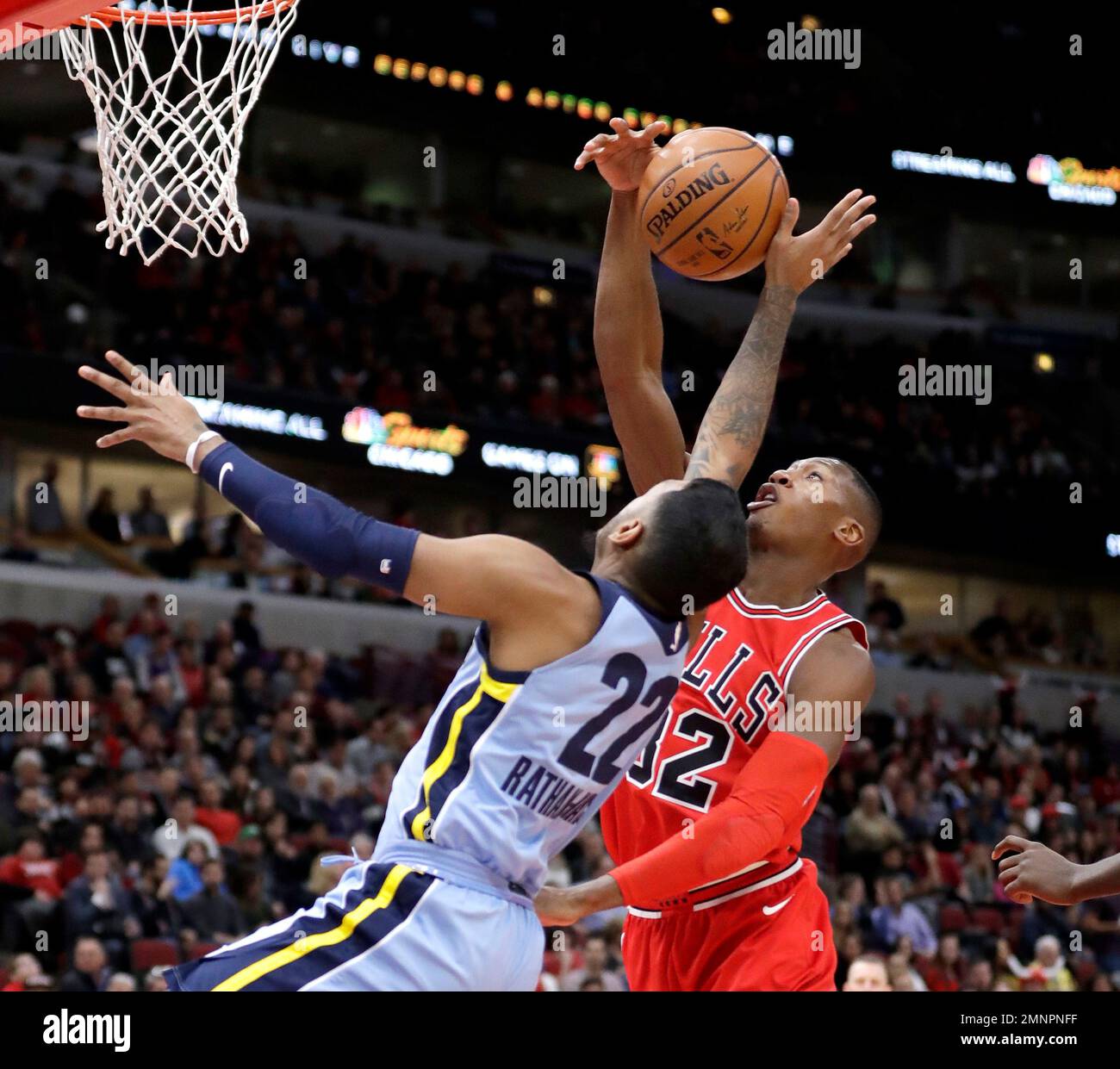 Chicago Bulls' Kris Dunn, right, blocks the shot and fouls Memphis ...