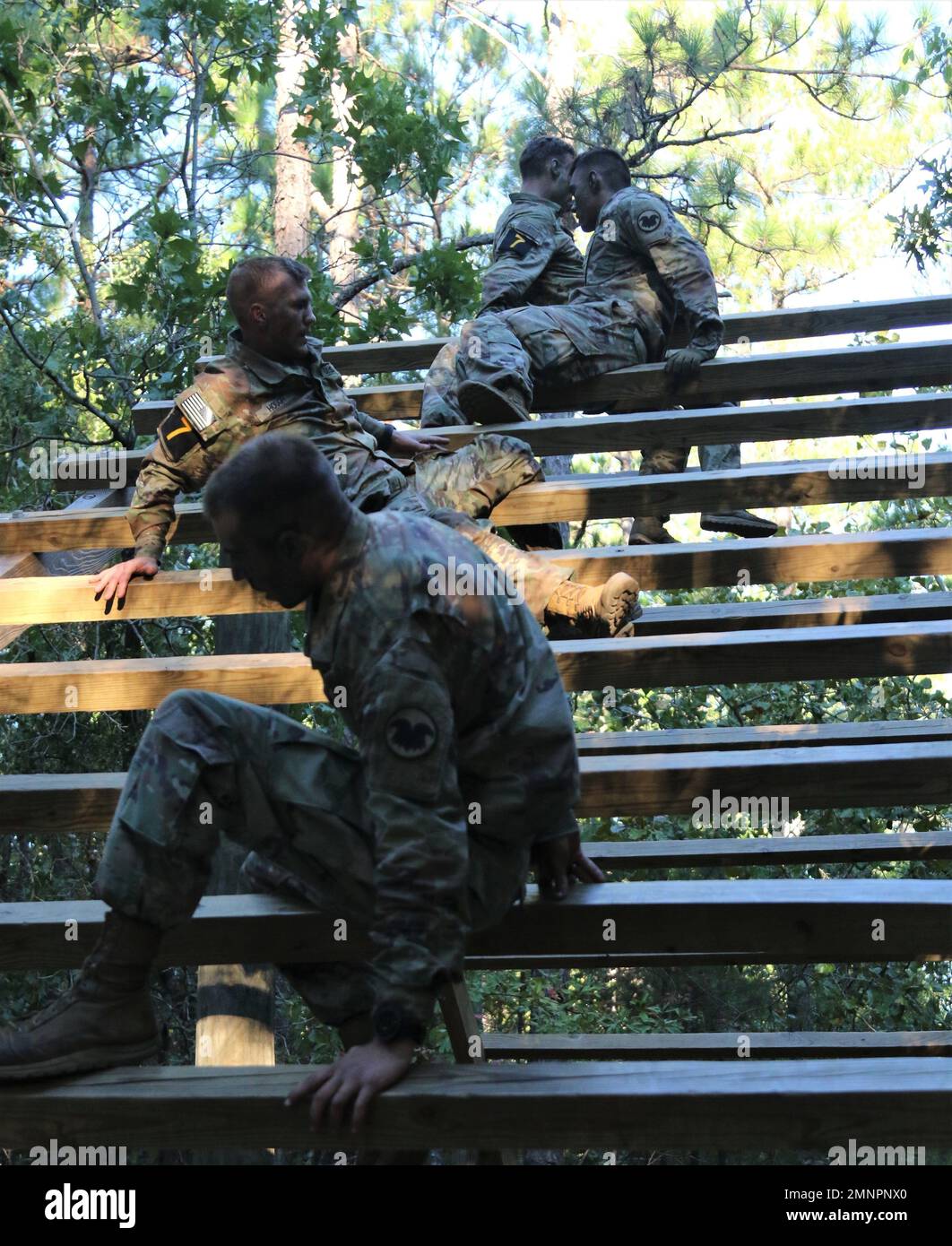 U.S. Soldiers from Squad 7, U.S. Army Reserve (USAR), navigate the ...