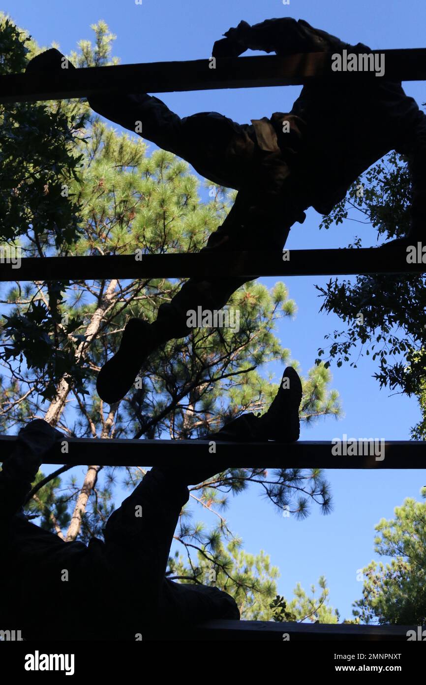 U.S. Soldiers navigate the "Weaver" at the All-American Mile obstacle ...