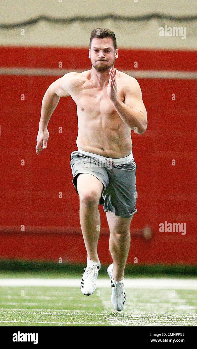 Alabama wide receiver Austin Johnson runs the 40-yard dash during ...