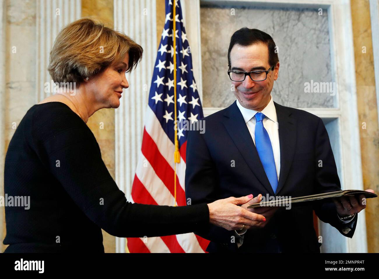 Bay Buchanan, with the National Collector's Mint, left, hands a letter ...