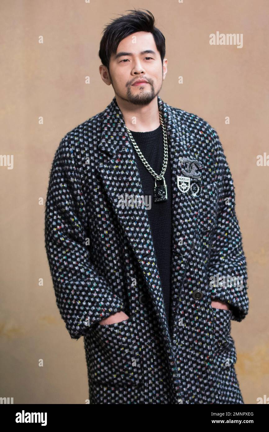 Jay Chou poses for photographers prior to the Chanel ready-to-wear fall ...