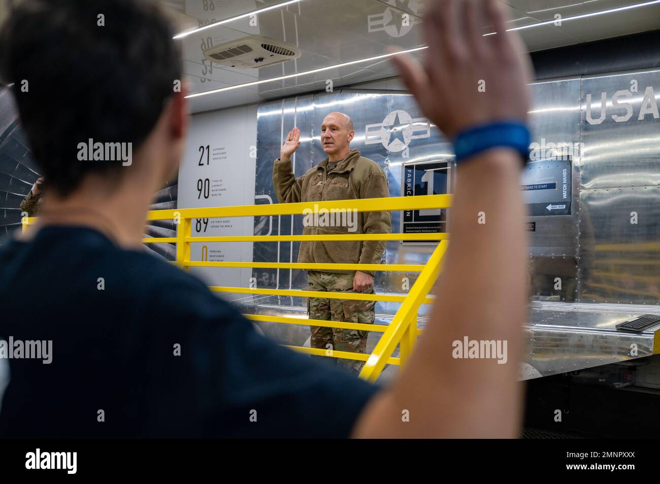 A member of the delayed entry program (DEP) takes part in a swearing in ...
