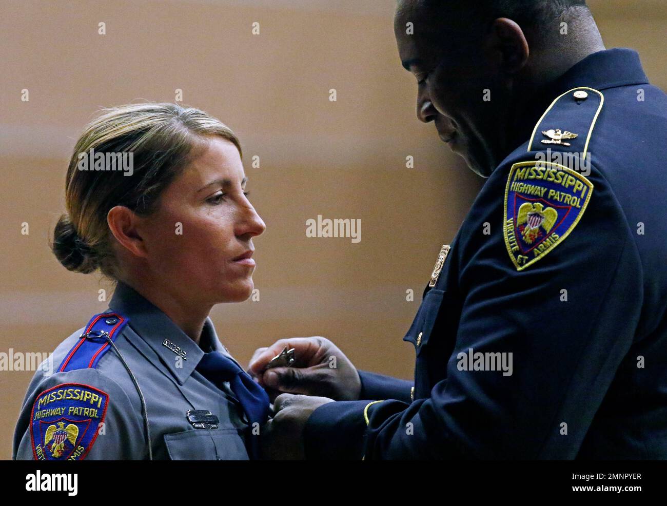 Mississippi Highway Patrol Director Col. Chris Gillard, right , pins ...