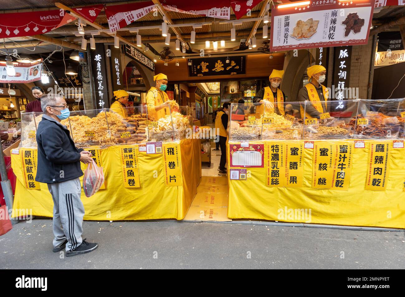 A stall selling dried squid,, nuts, dried meats and other snacks at the ...