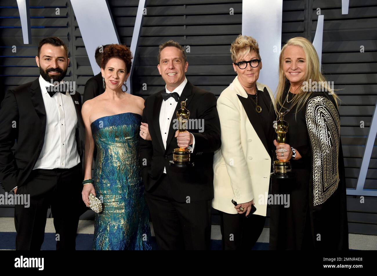 Lee Unkrich, center, Darla K. Anderson, right, and the team from "Coco ...