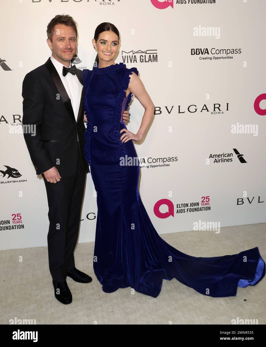 Chris Hardwick, left, and Lydia Hearst arrive at the 2018 Elton John ...