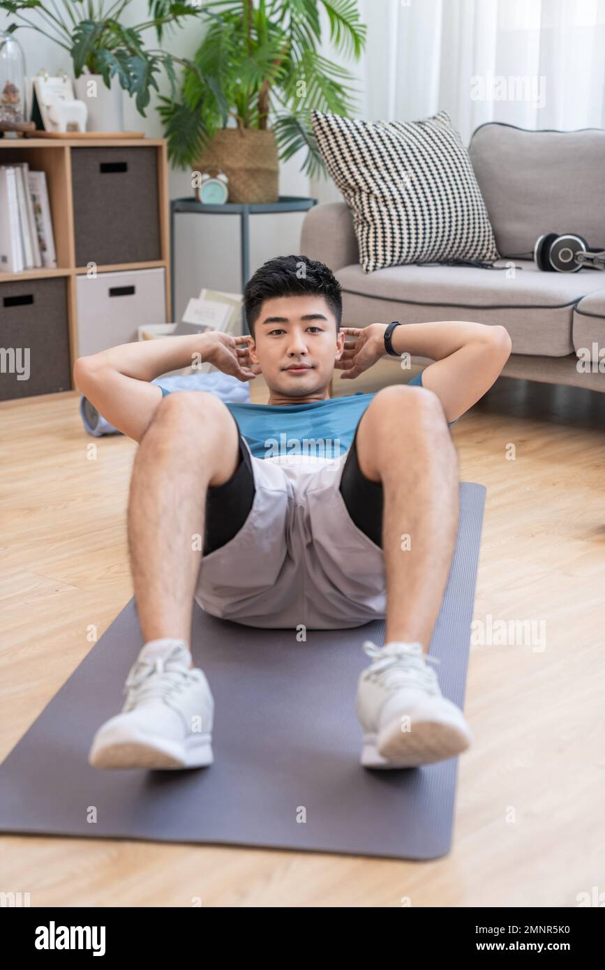Young men sit ups hi-res stock photography and images - Alamy