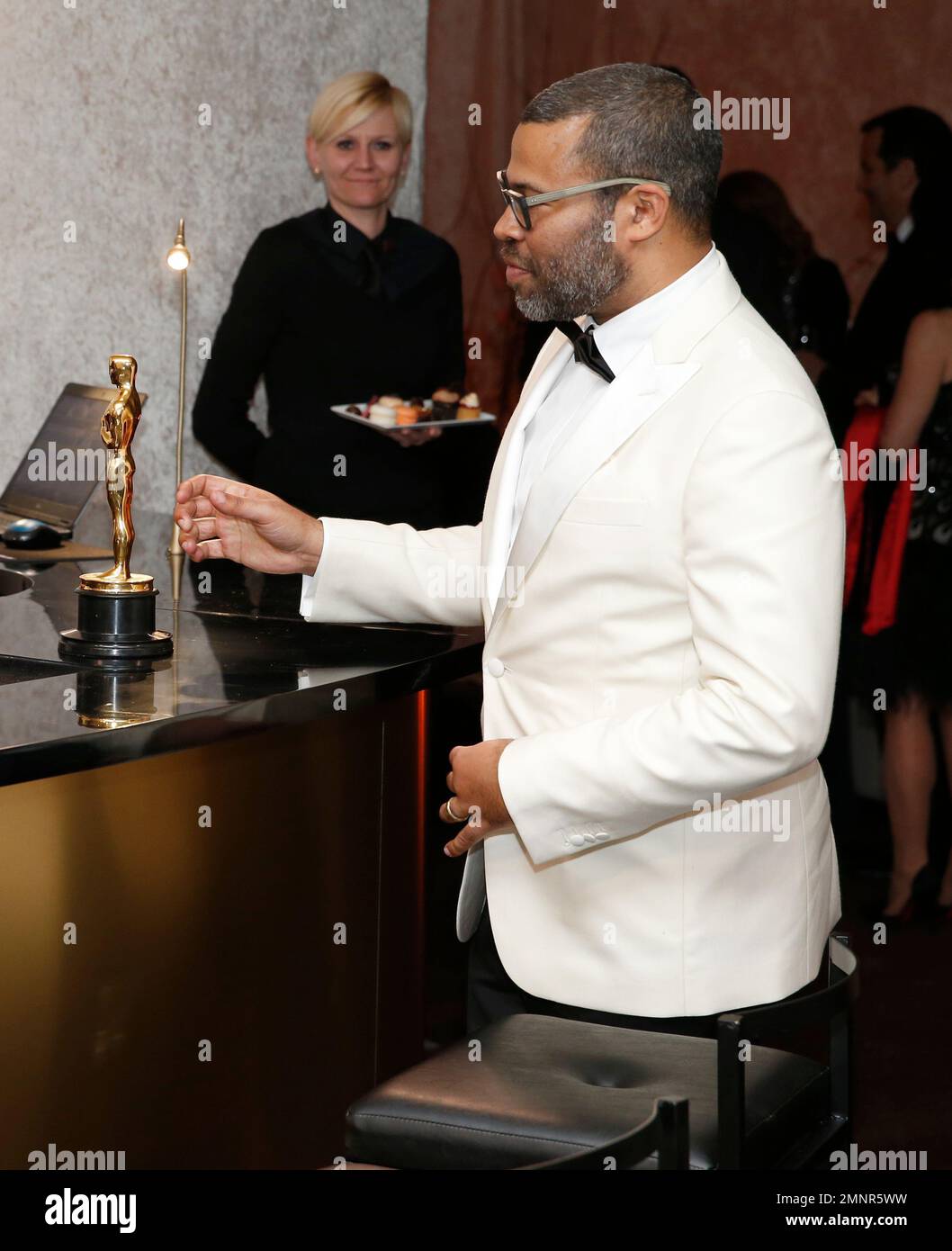 Jordan Peele picks up his Oscar for best original screenplay as he ...