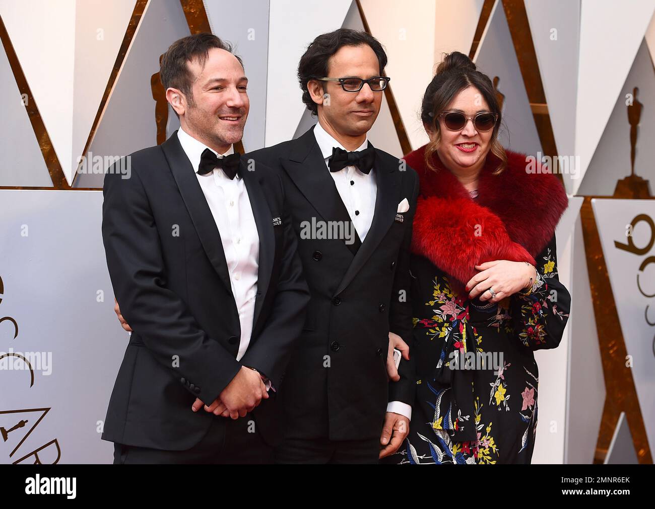 Bryan Fogel, from left, Dan Cogan, and Liz Garbus arrive at the Oscars ...