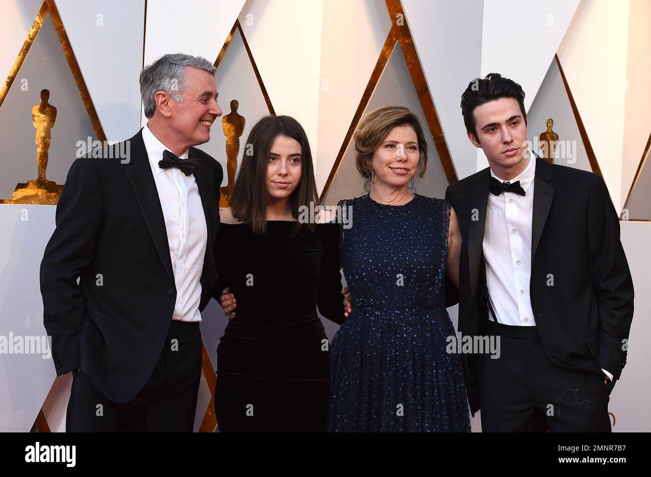 Daniel Lupi, left, JoAnne Sellar, second from right, and guests arrive ...