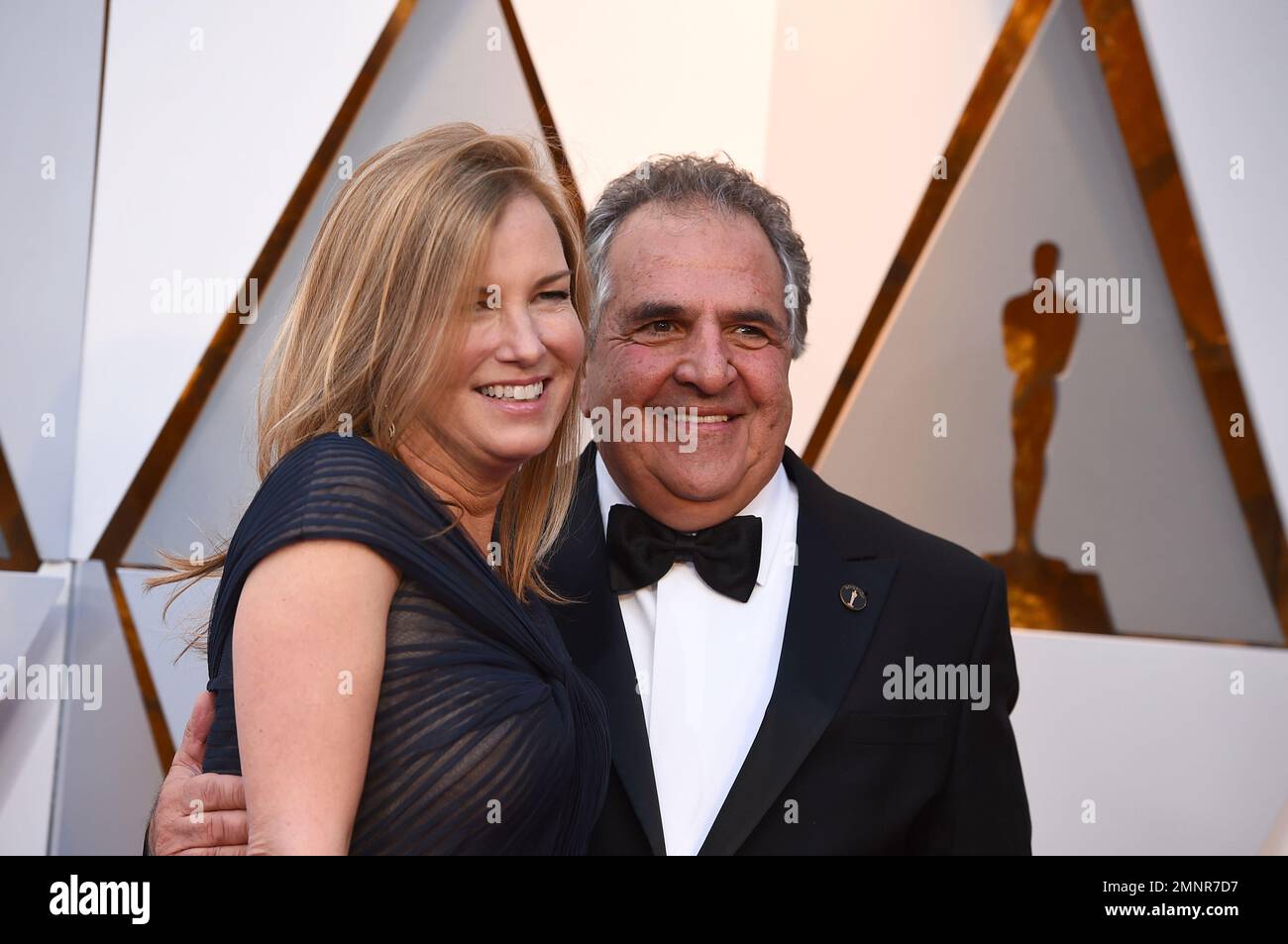 Ann Gianopulos, left, and Jim Gianopulos arrive at the Oscars on Sunday ...