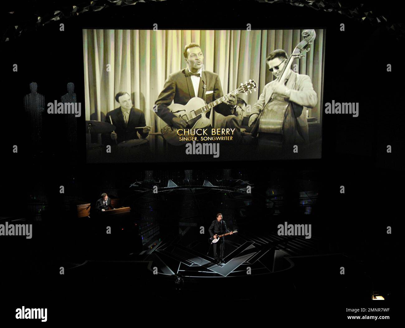 Chuck Berry appears on screen as Eddie Vedder performs during an In ...
