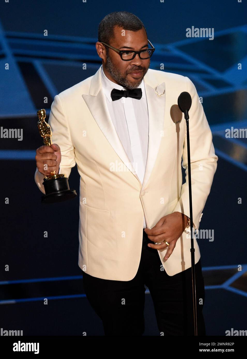 Jordan Peele accepts the award for best original screenplay for "Get ...
