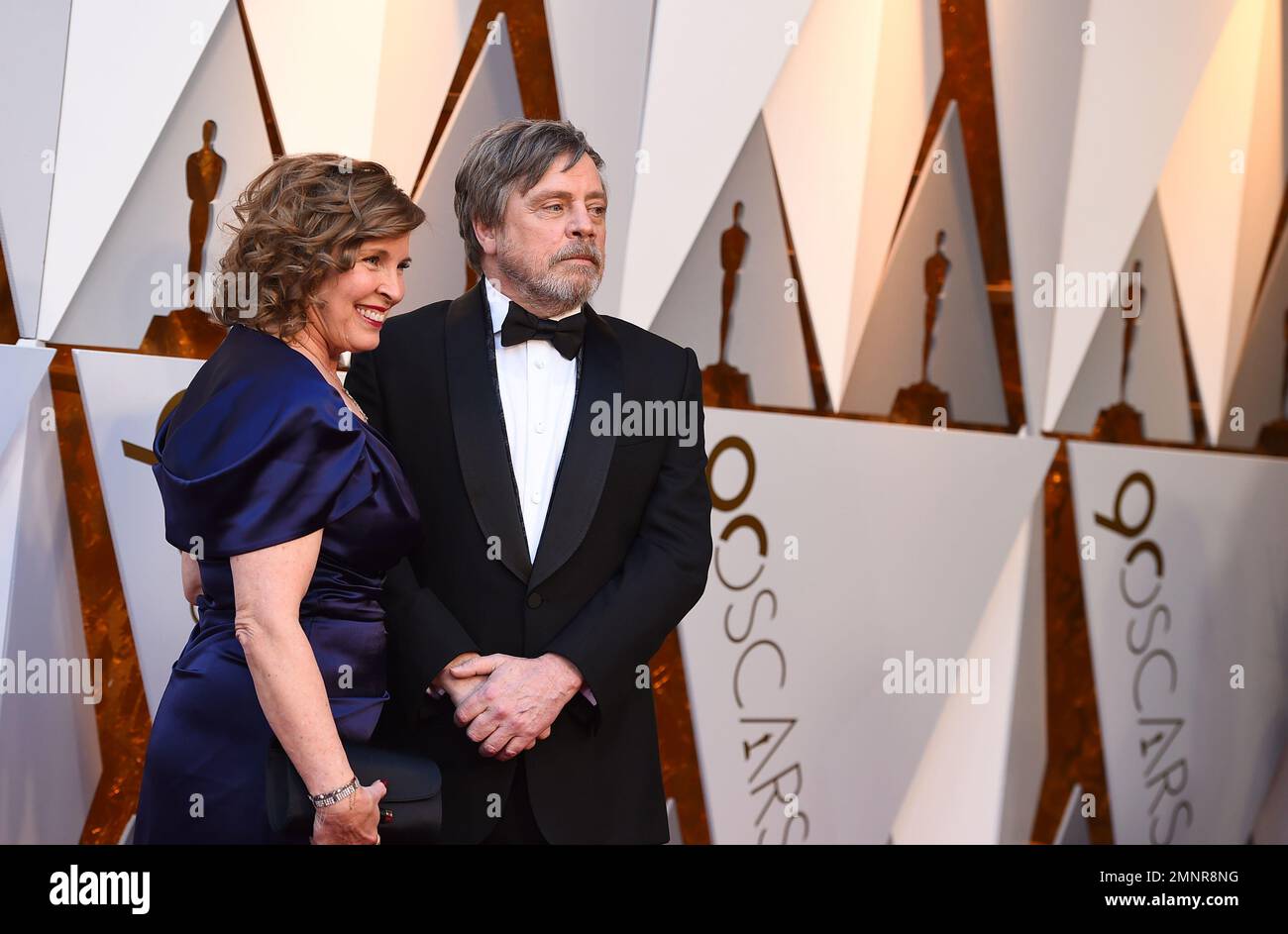 Marilou York, left, and Mark Hamill arrive at the Oscars on Sunday ...