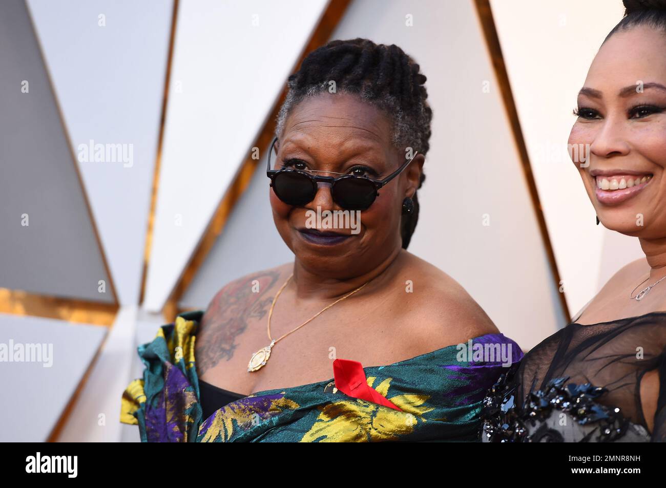 Whoopi Goldberg, left, and Alex Martin arrive at the Oscars on Sunday ...