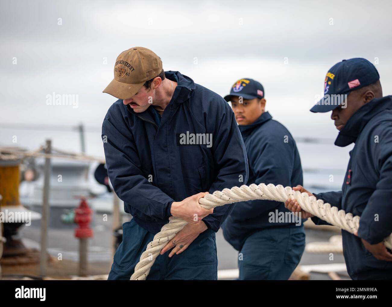 Boatswain’s Mate Seaman Patrick Ryan, left assigned to the Arleigh ...