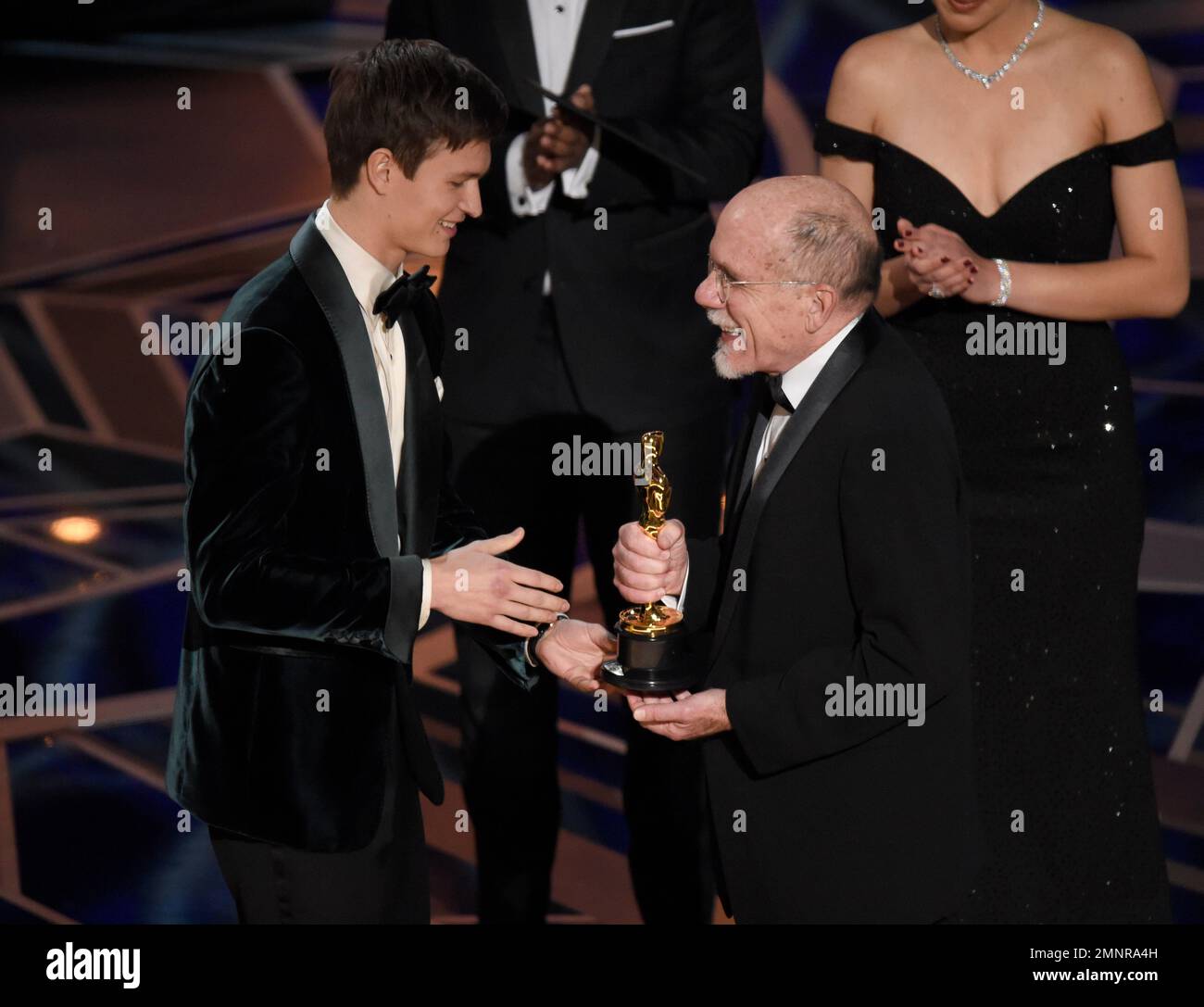 Ansel Elgort, left, presents Richard King the award for best sound ...