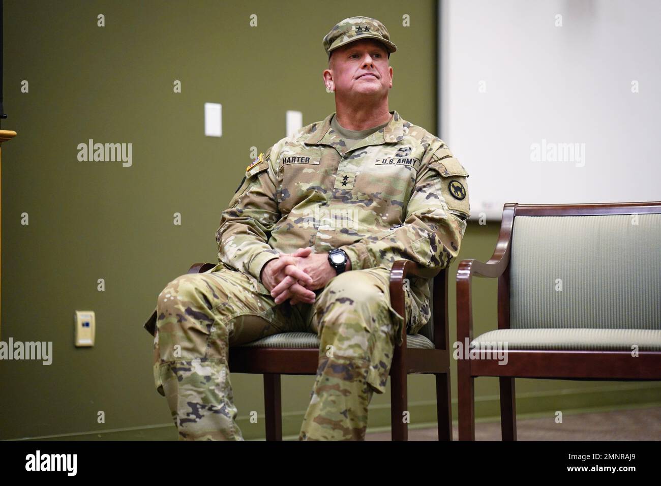 Maj. Gen. Bob D. Harter looks on during his assumption of command ...