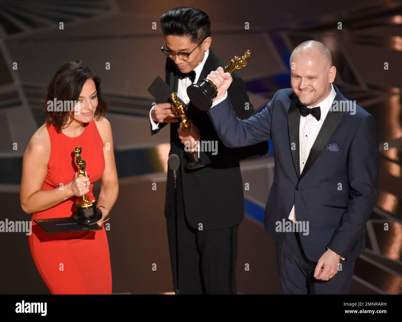 Lucy Sibbick, from left, Kazuhiro Tsuji, and David Malinowski accept ...