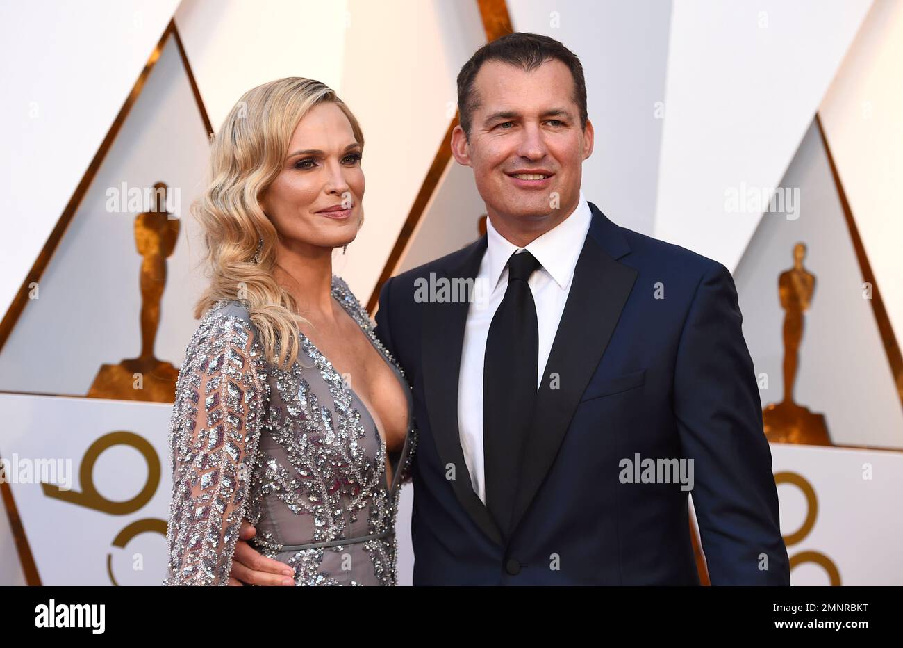 Molly Sims, left, and Scott Stuber arrive at the Oscars on Sunday ...