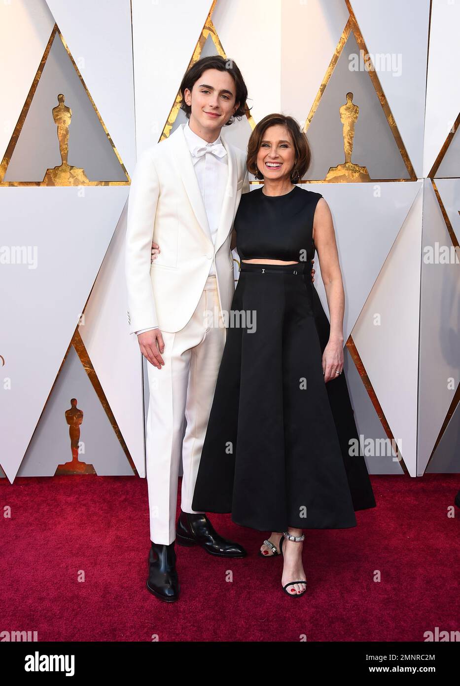 Timothee Chalamet, left, and Nicole Flender arrive at the Oscars on ...